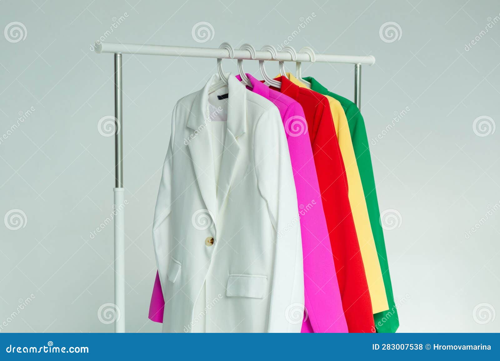 Multi-colored Bright Jackets on a Hanger on a White Background Stock ...