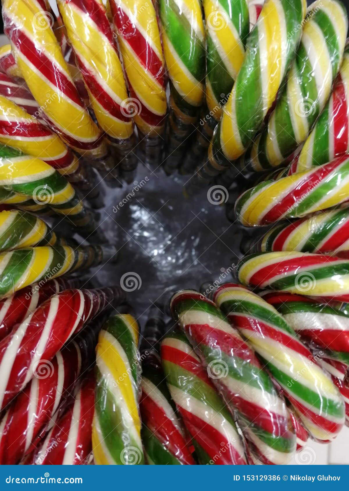 Multi-colored Cane Mint Candy in the Form of a Cane in a Round Box ...