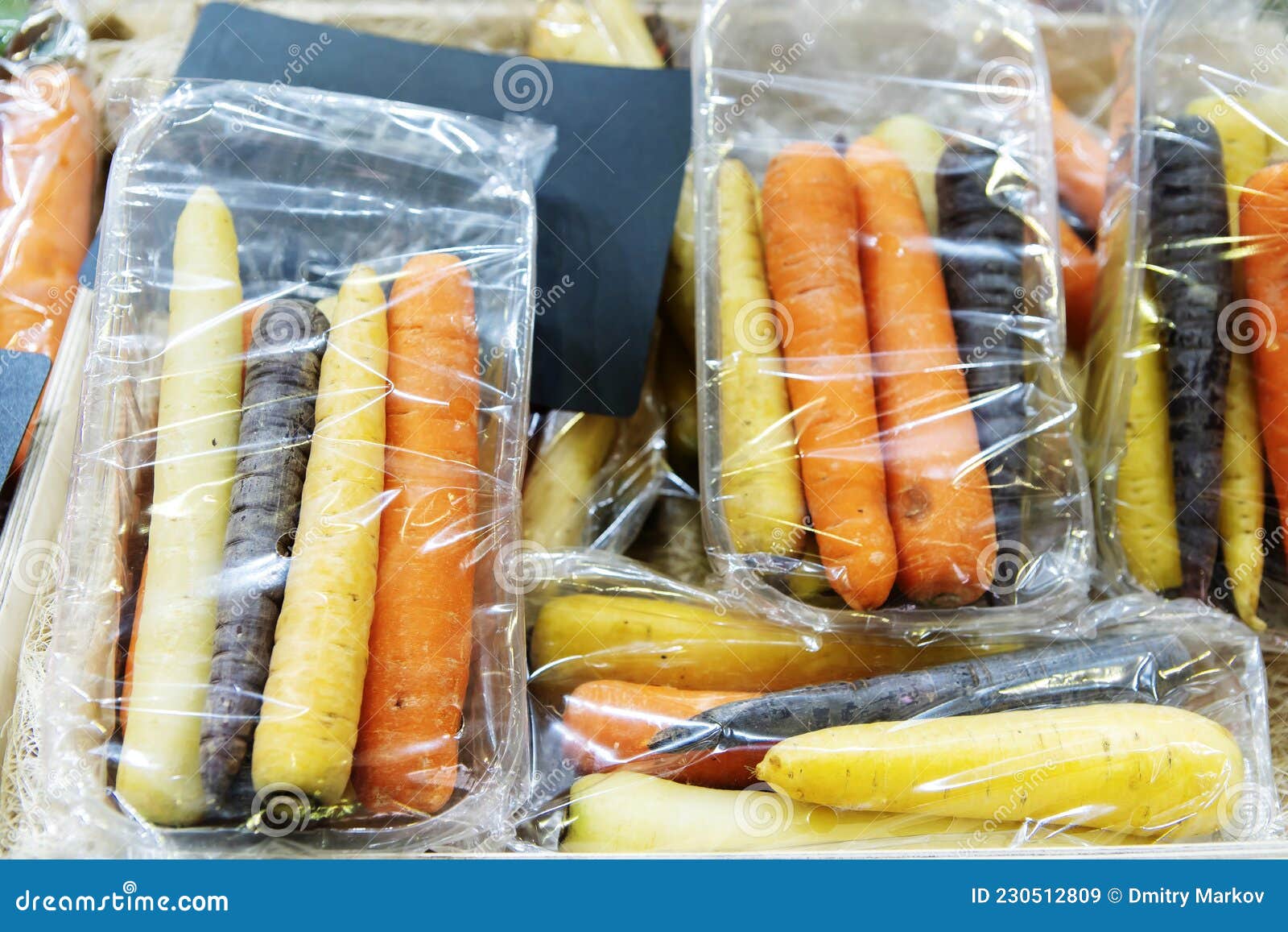 Multi-colored Carrots in Plastic Packaging Lie on a Shelf in a Store ...