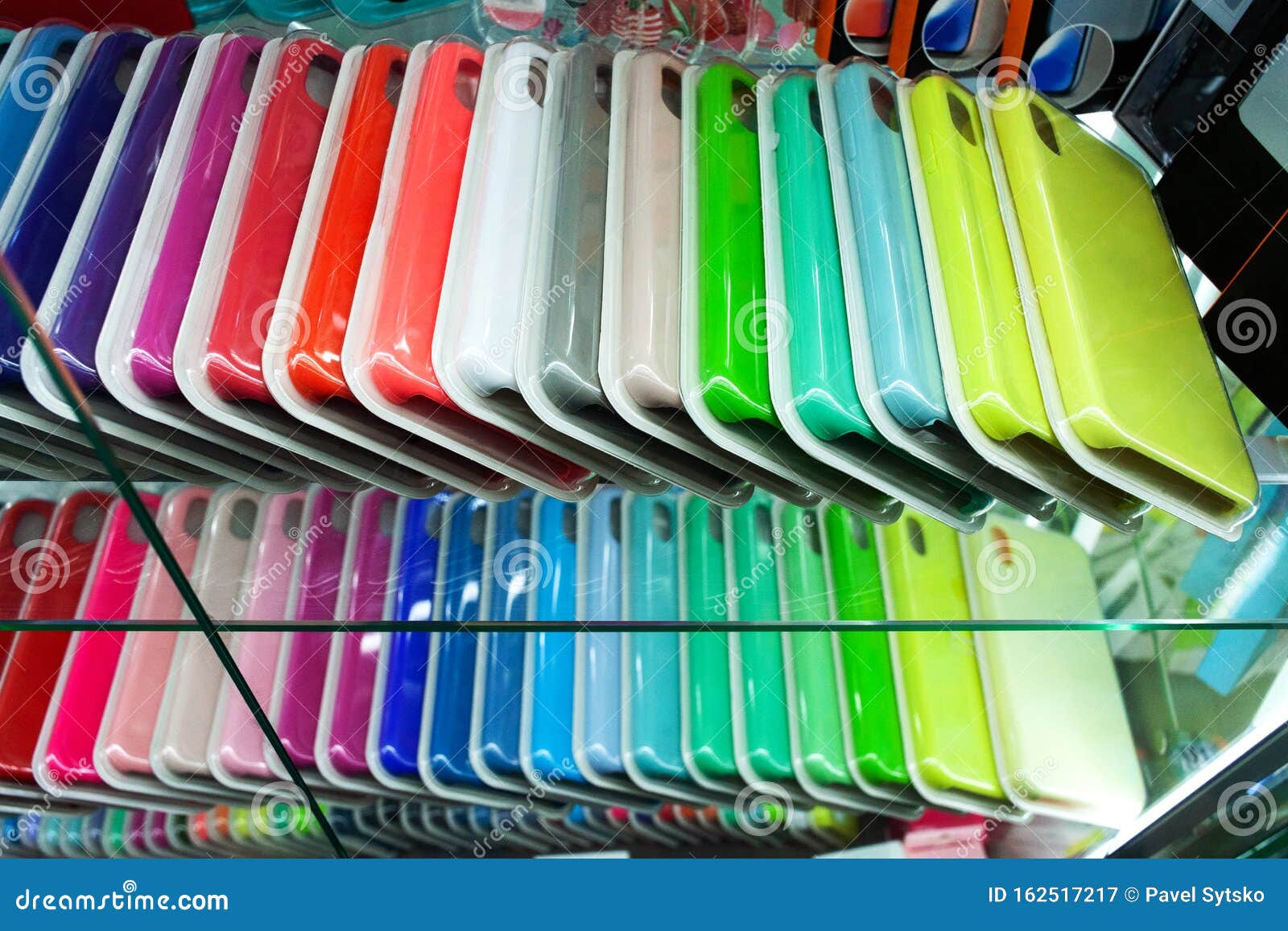 Multi-colored Cases for the Smartphone on a Shop Window. Choosing Case ...