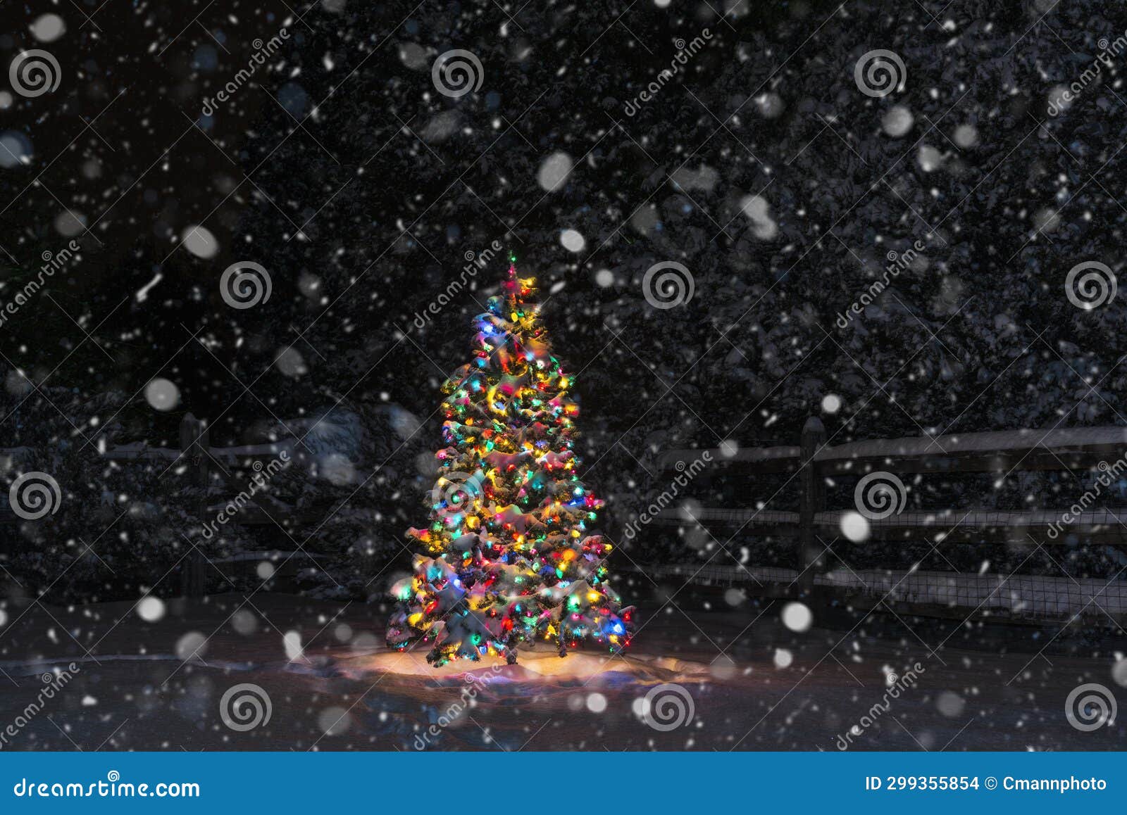 Multi-Colored Christmas Tree at Night while Snowing Stock Photo - Image ...