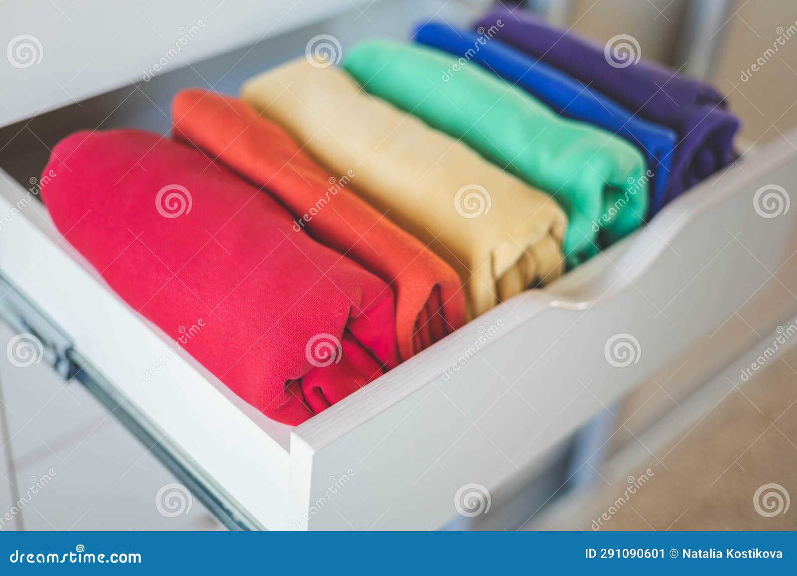 Multi-colored Clothes Folded Vertically in a Wardrobe Drawer. the ...