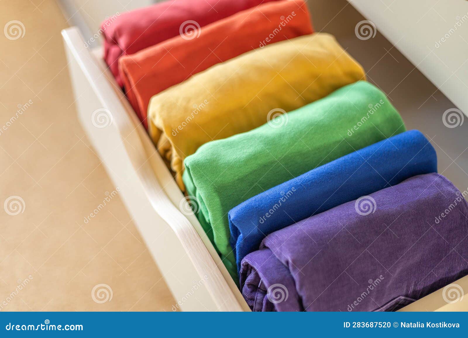 Multi-colored Clothes Folded Vertically in a Wardrobe Drawer. the ...