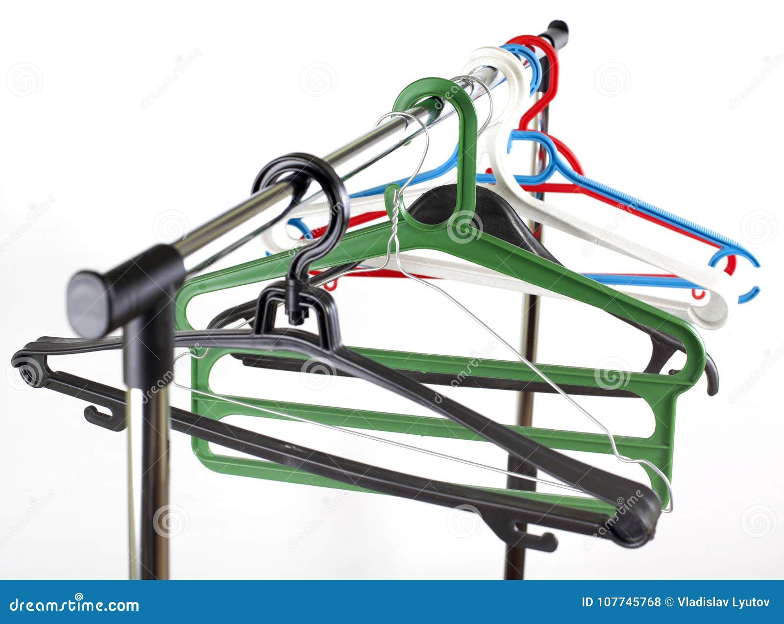 Multi Colored Clothes Hangers on Metal Crossbar Over White. Stock Photo ...