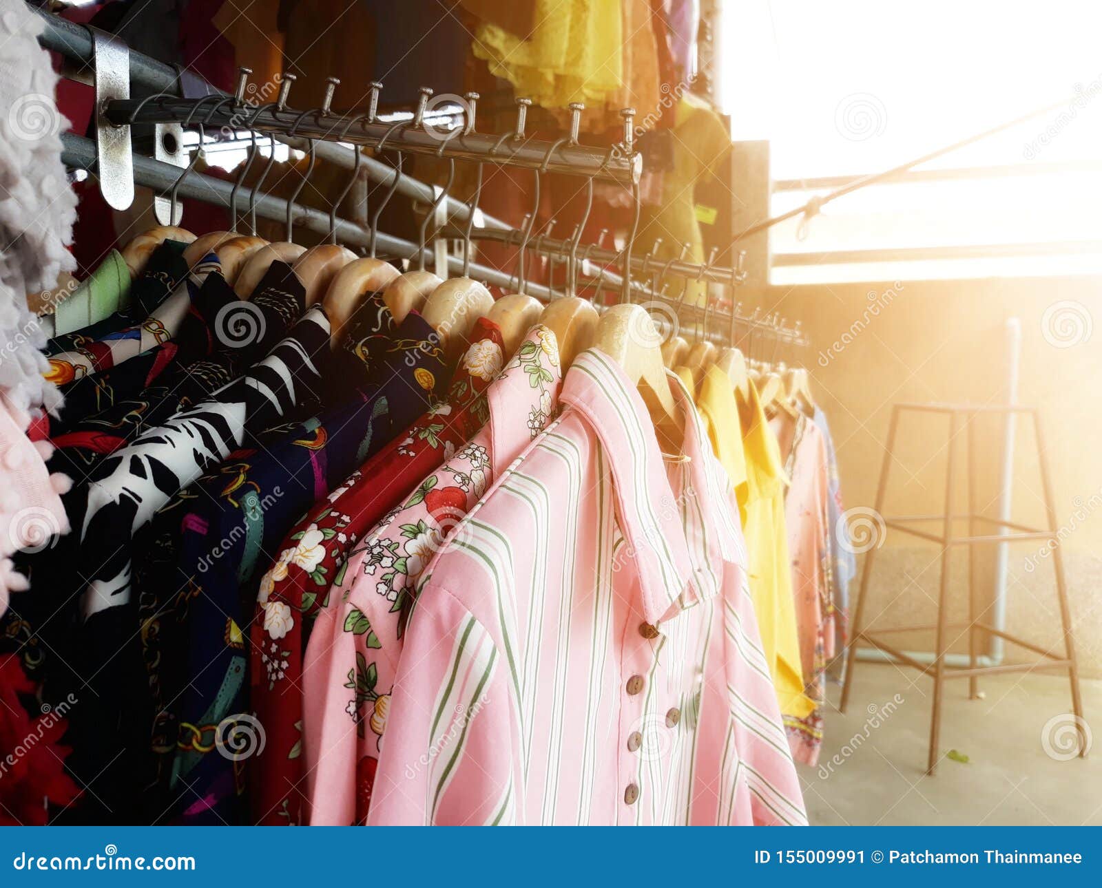 Multi-colored Clothes Hanging on the Clothesline in the Shop are Sunny ...