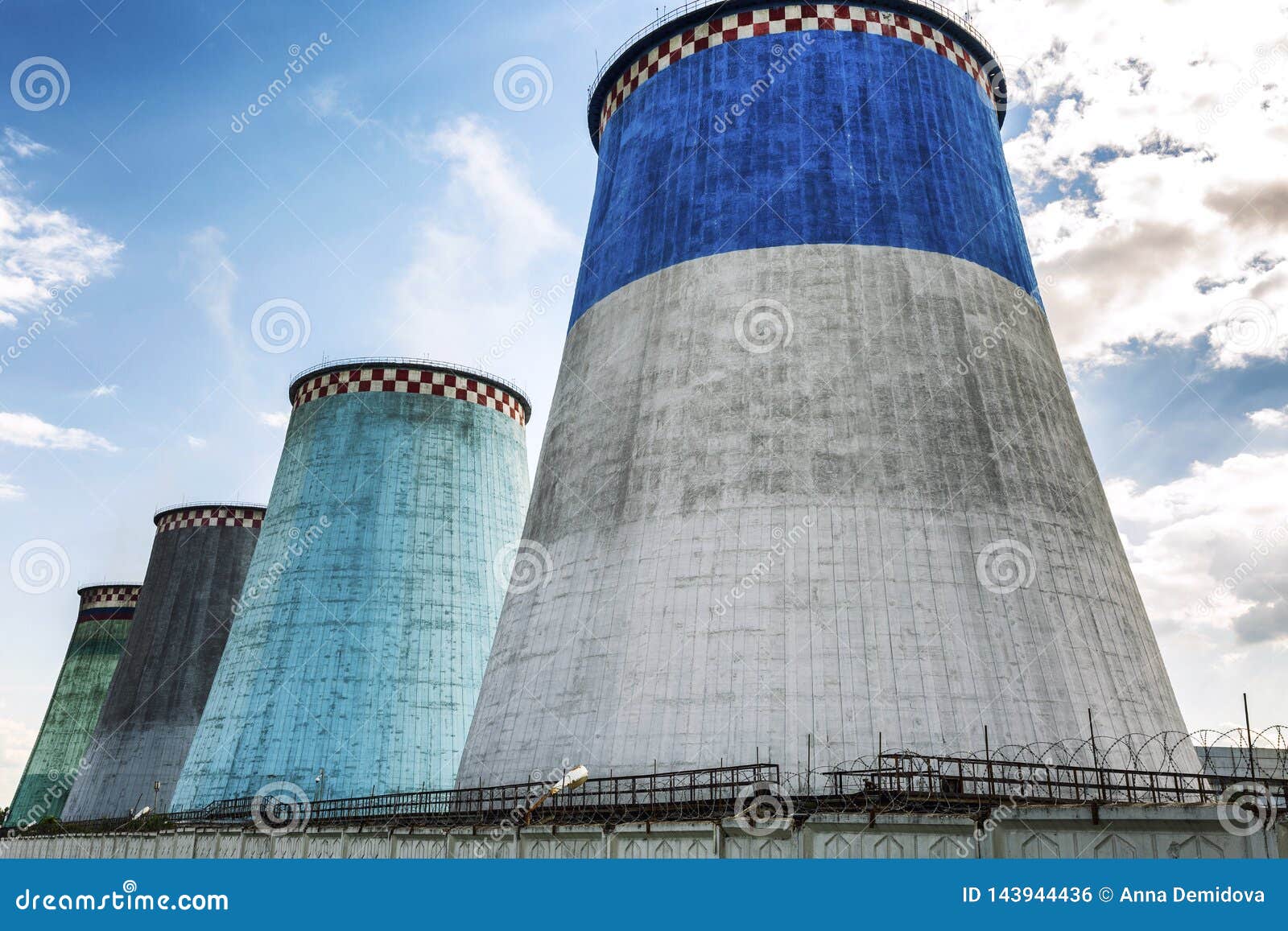 Multi-colored Cooling Towers on a Background of Bright Blue Sky. Stock ...