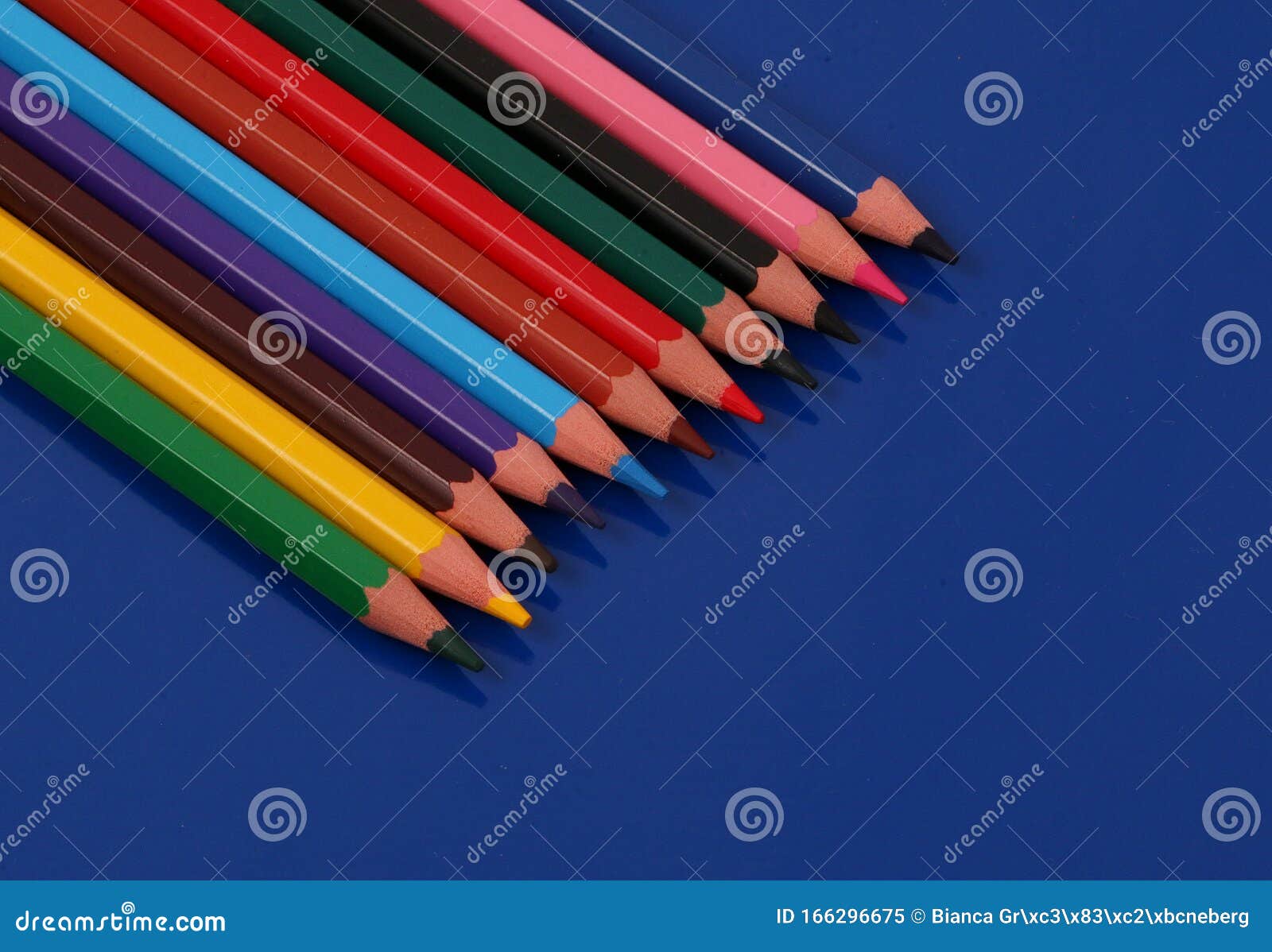 Different Colored Crayons Lie in a Row on a Blue Background Stock Image ...
