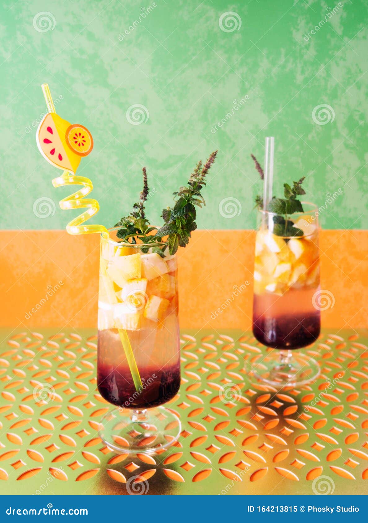 Multi-colored Drinks with Pieces of Fruit, Mint and an Unusual Straw ...