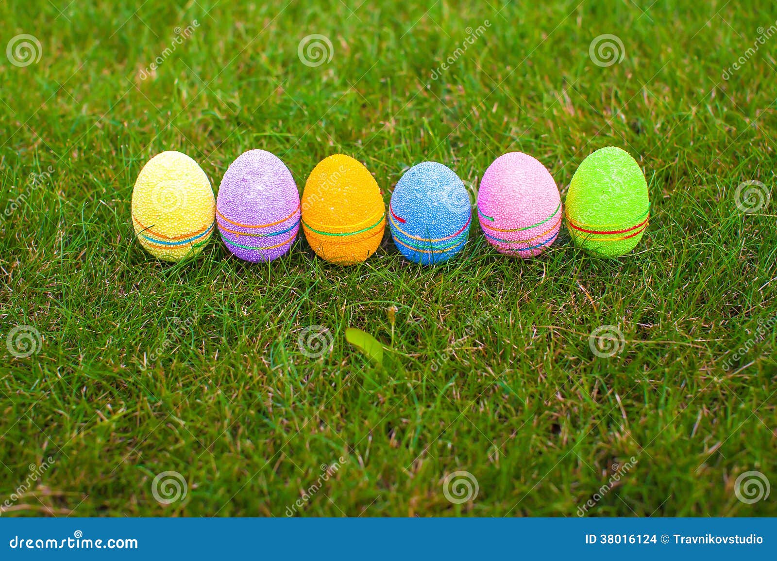 Multi-colored Easter Eggs on Green Grass Stock Photo - Image of colored ...