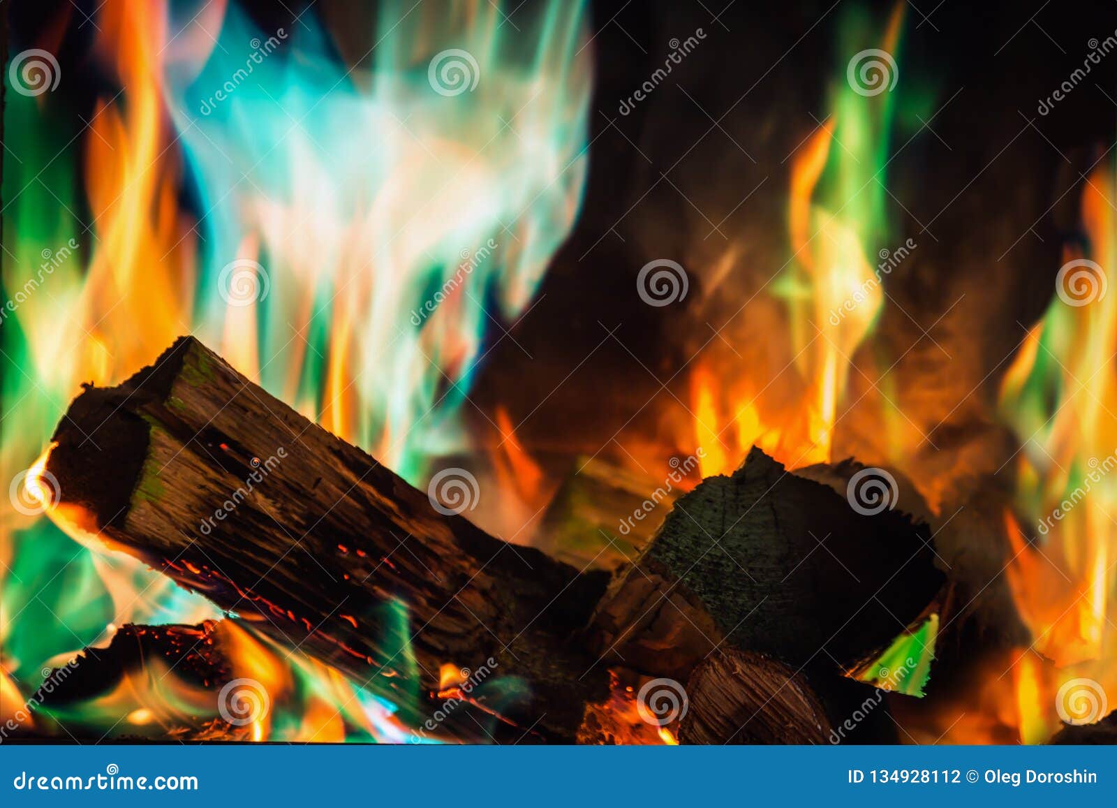 Multi-colored Flame of Fire Burns in the Fireplace Stock Photo - Image ...