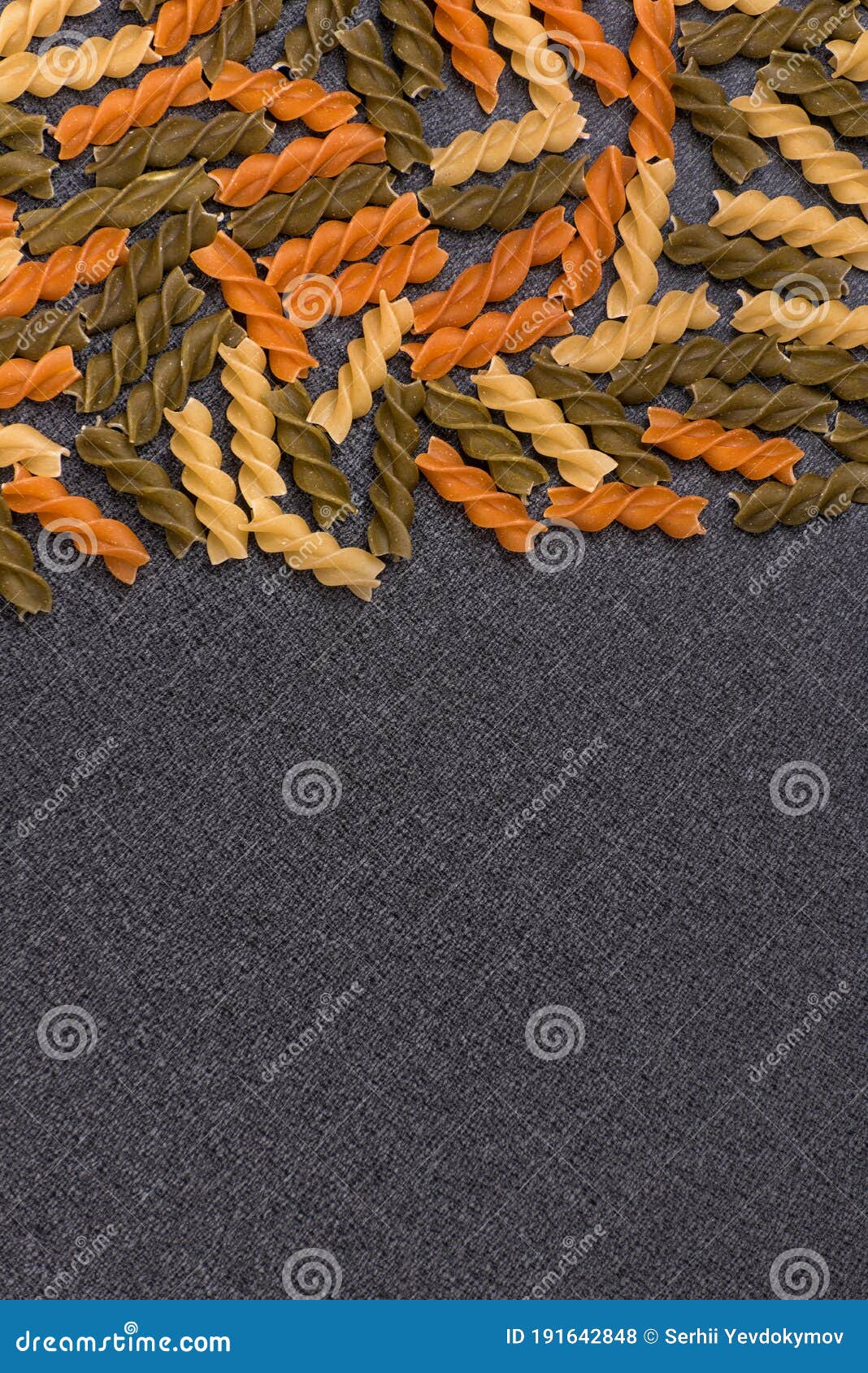 Multi-colored Fusilli on Gray Background. Pasta Background. Copy Space ...