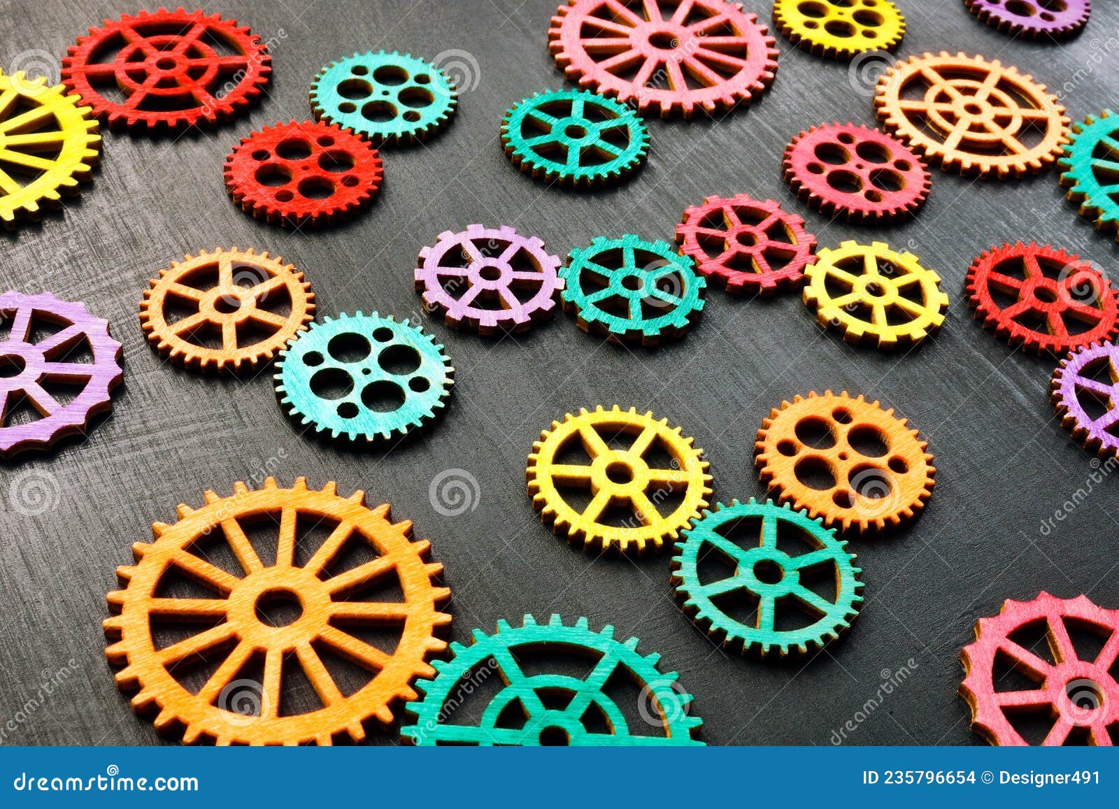 Multi-colored Gear Wheels on a Dark Surface. Variety and Interaction ...