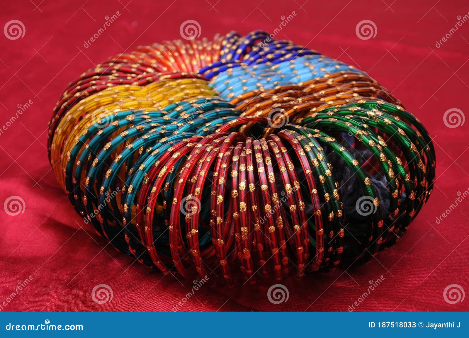 Multi Colored Glass Bangle Arranged in a Pattern on a Plate Stock Image ...