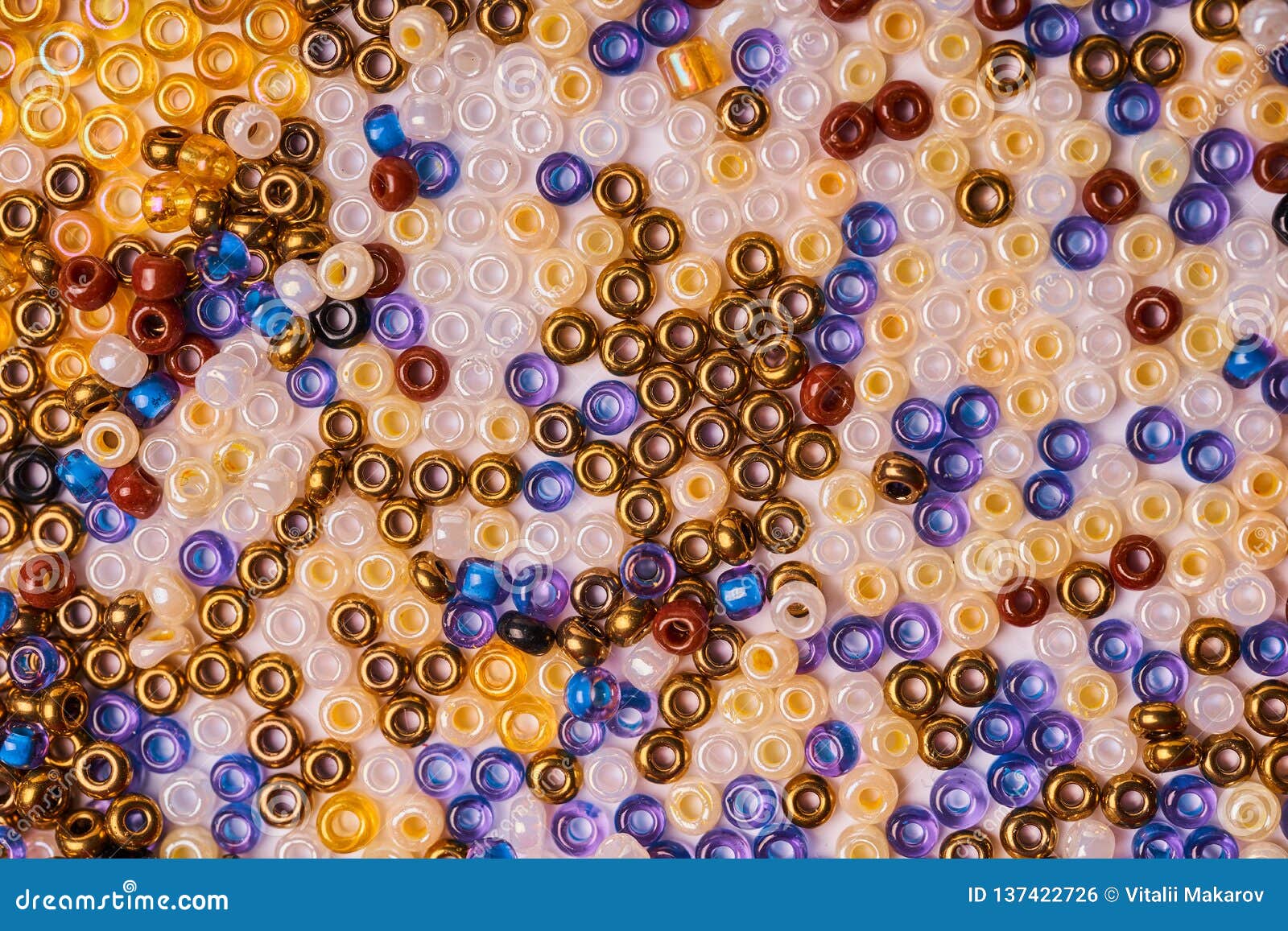 Multi-colored Glass Seed Beads on a White Background Stock Photo ...
