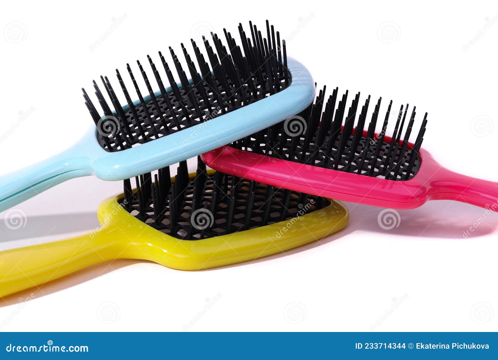 Multi-colored Hair Combs on an Isolated White Background. Stock Photo ...