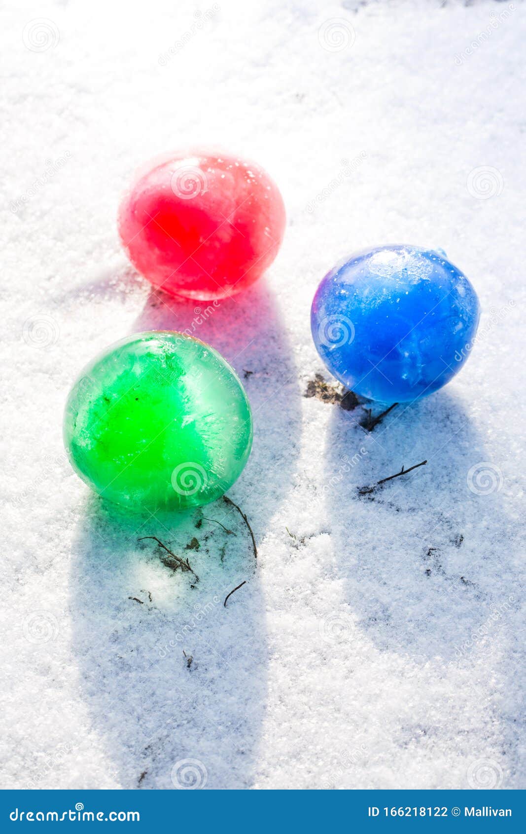 Multi-colored Ice Balls in the Snow on a Sunny Day, Top View Stock ...