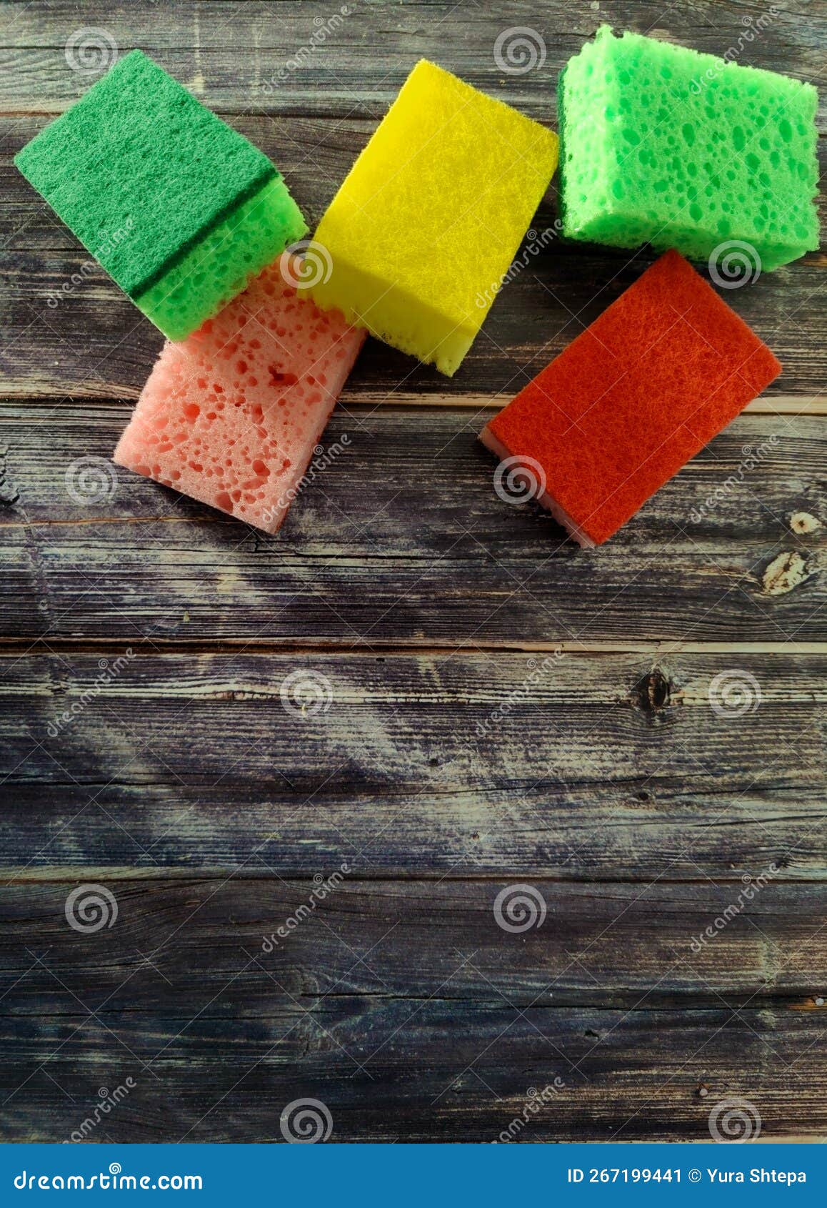 Multi-colored Kitchen Sponges for Washing Dishes on a Wooden Table ...