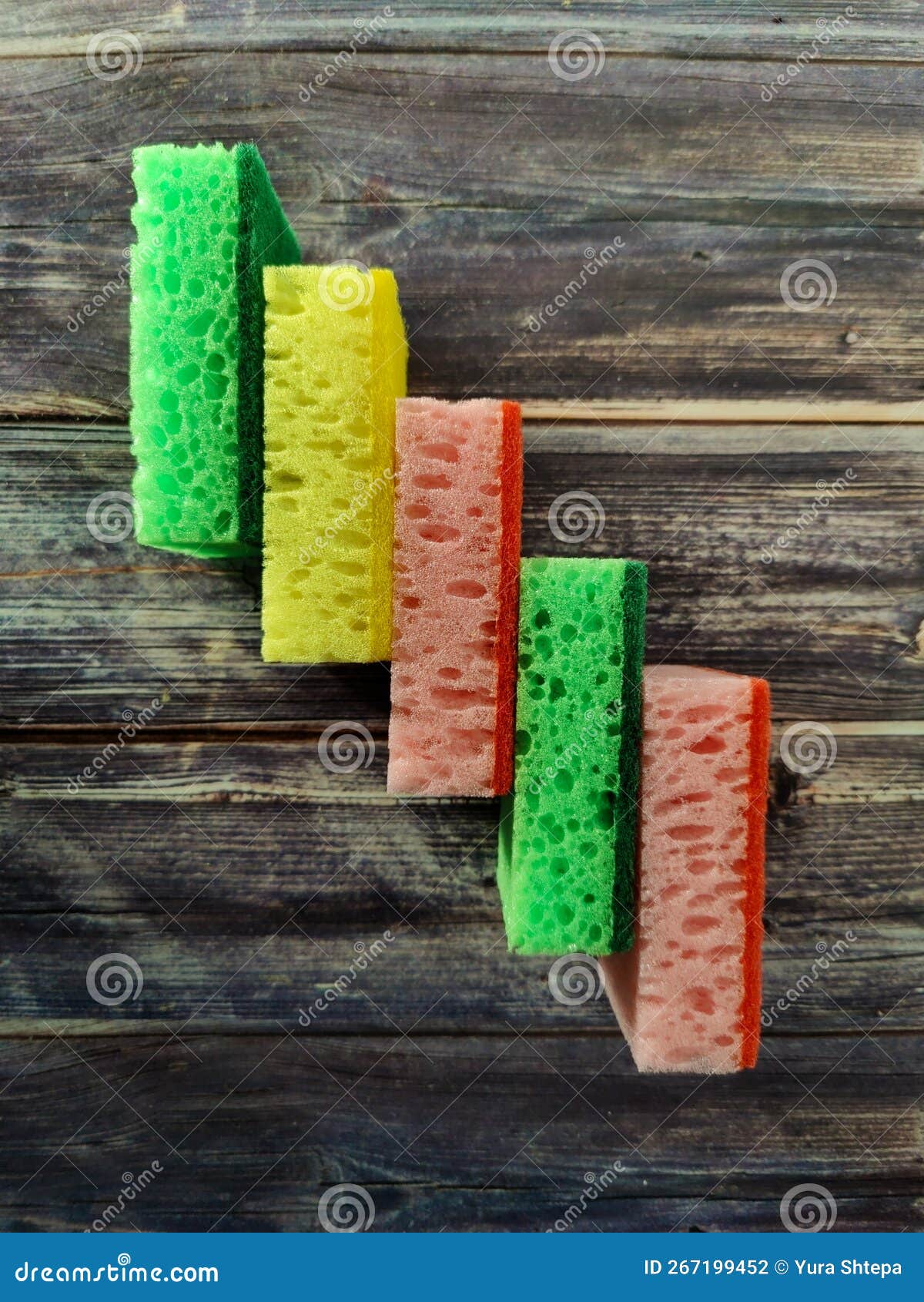 Multi-colored Kitchen Sponges for Washing Dishes on a Wooden Table ...