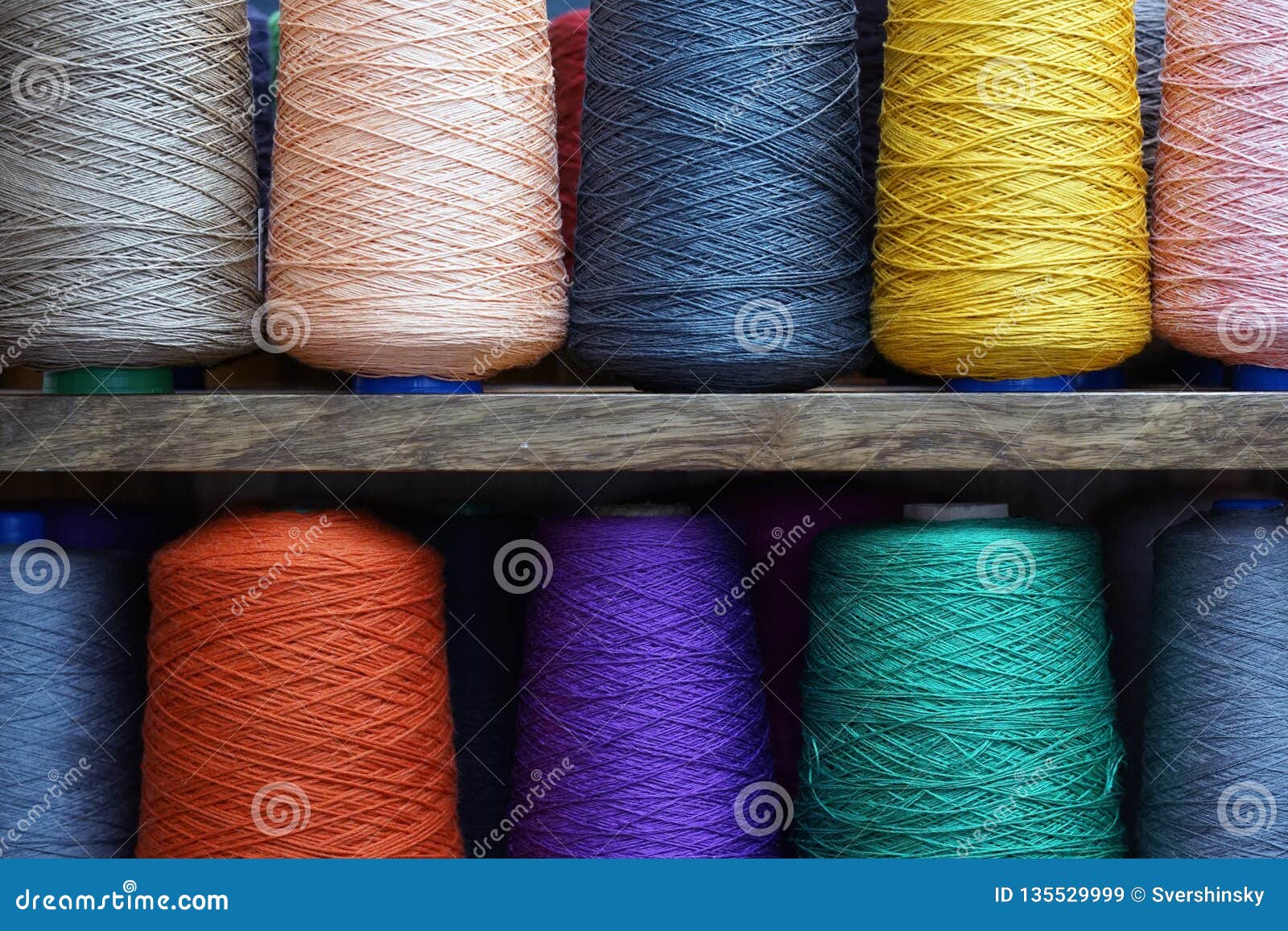 Multi-colored Large Spools of Thread in a Row. Spools of Colored Thread ...
