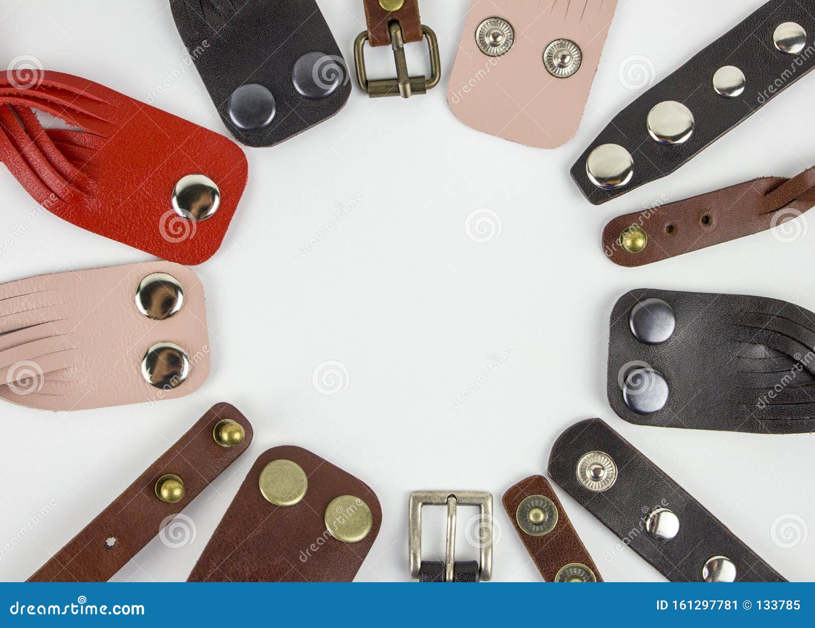 Multi-colored Leather Belts and Bracelets with Rivets on a White ...