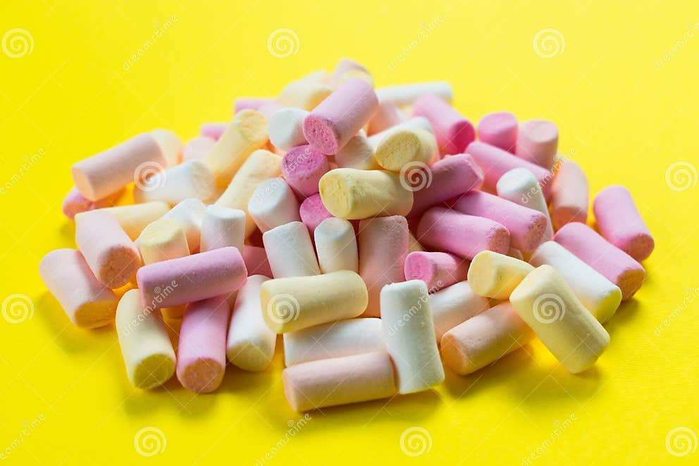 Multi-colored Little Marshmallows on a Bright Yellow Background. Stock ...