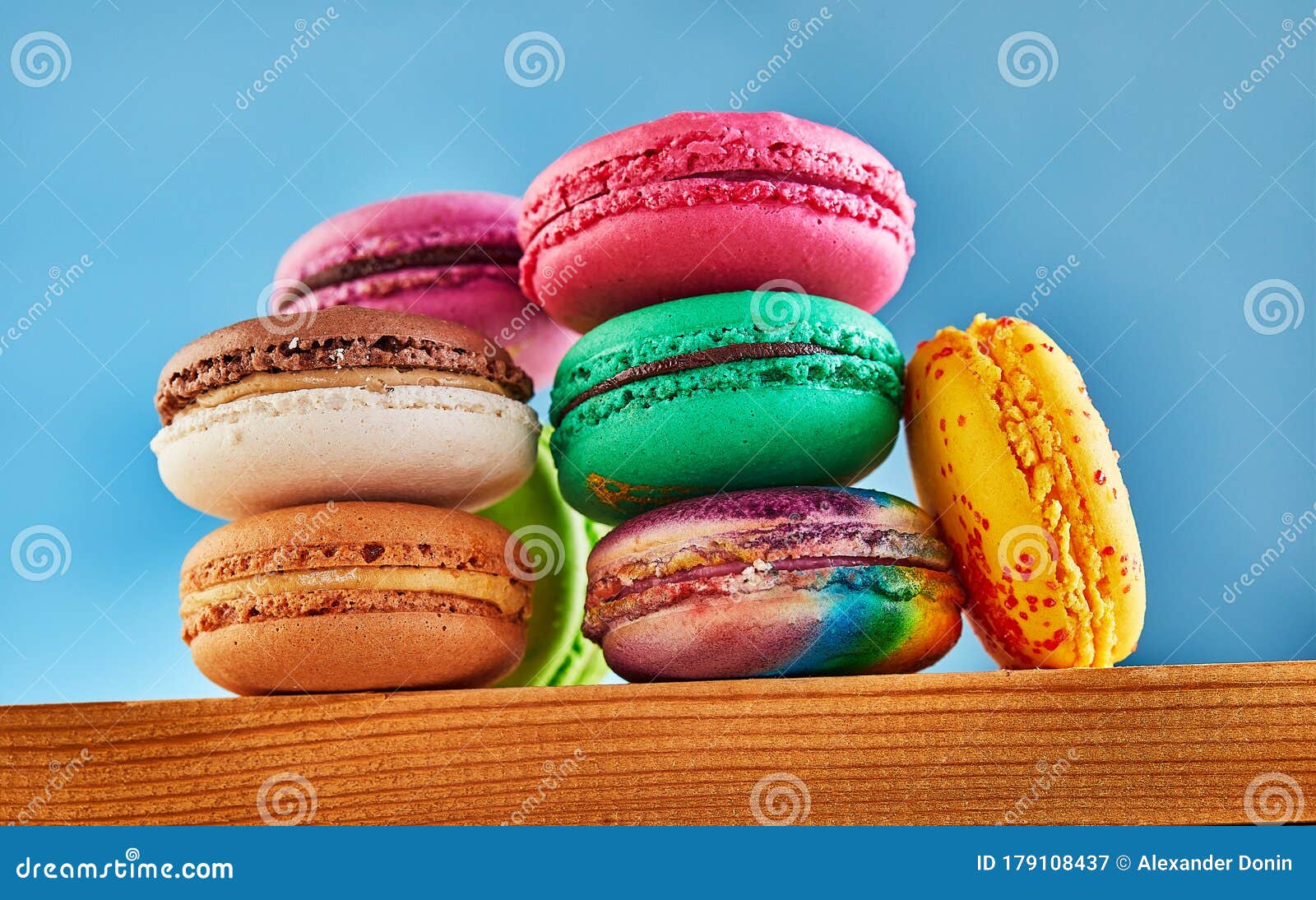 Multi-colored Macaron Folded in a Stack on a Wooden Background ...