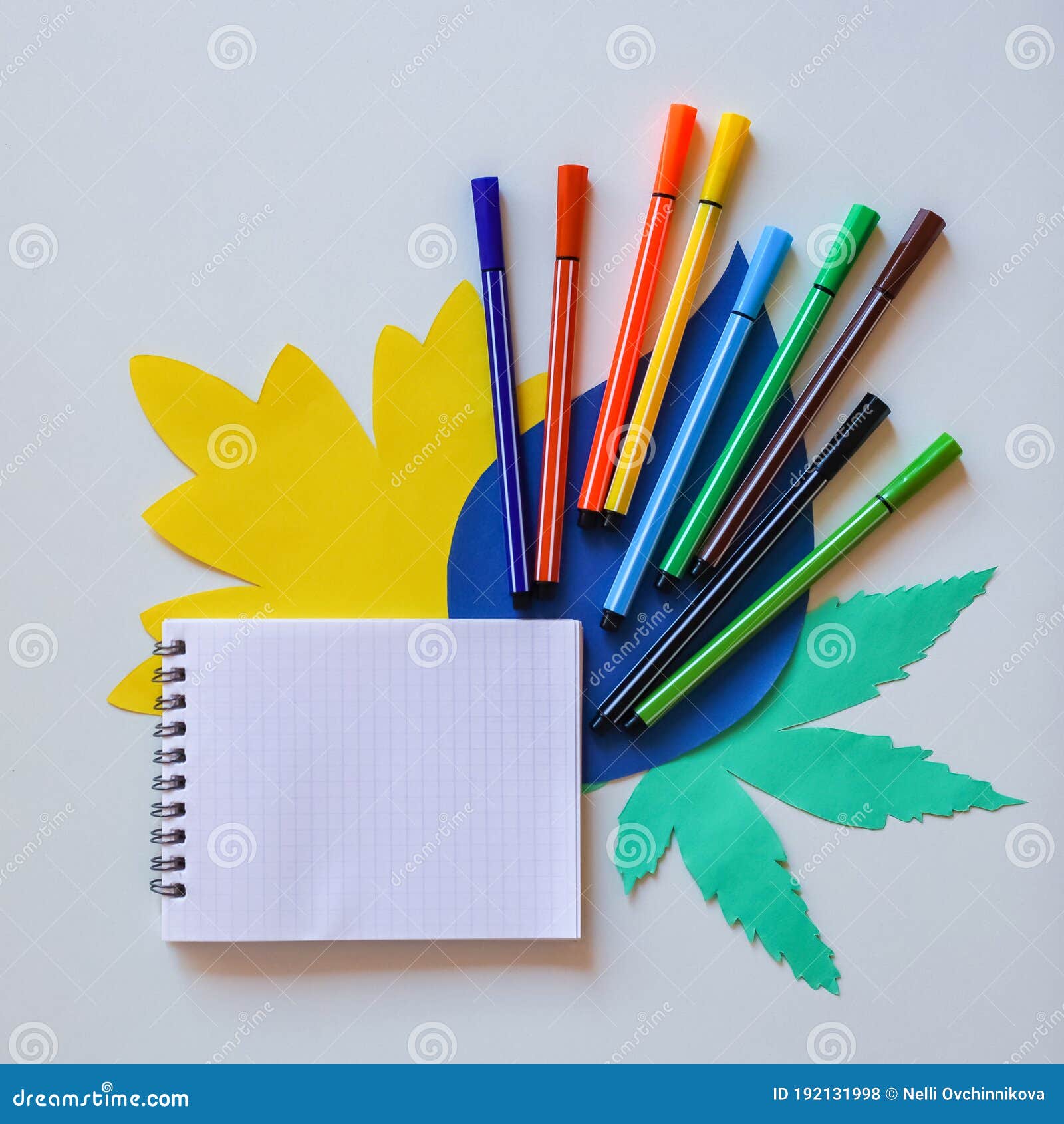 Multi Colored Markers and Notepad are on a White Surface Stock Photo ...