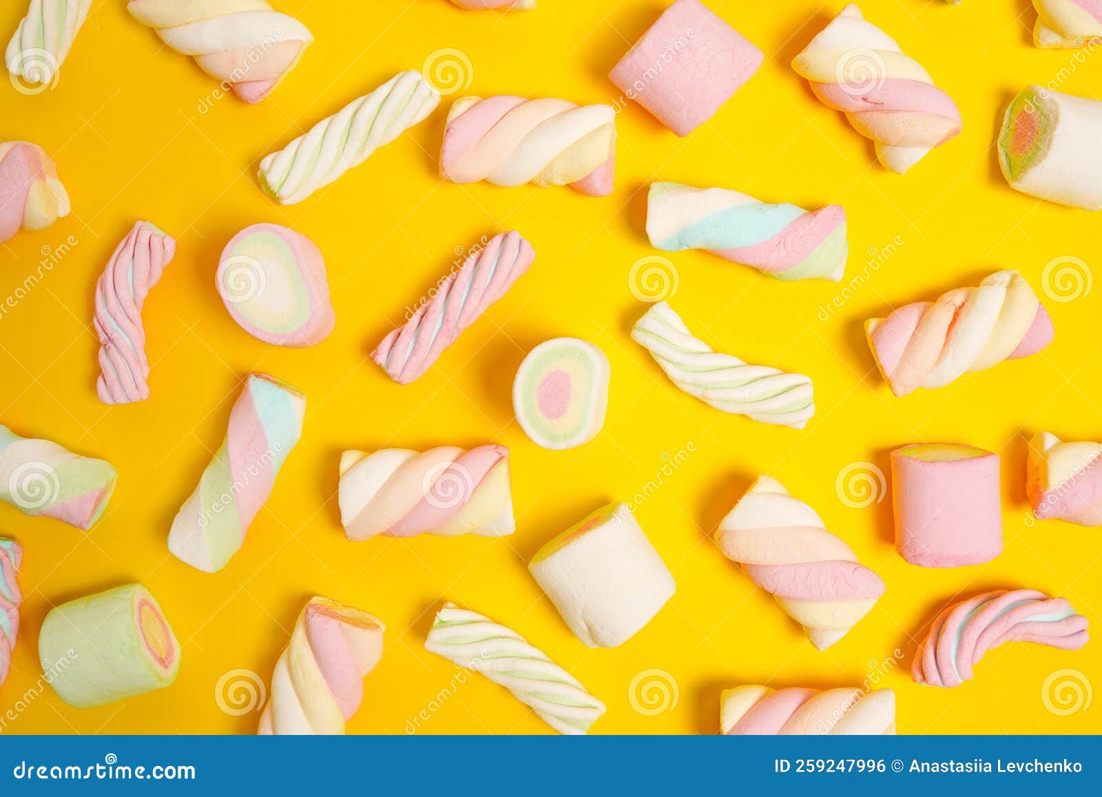 Multi-colored Marshmallows. Yellow Background or Texture of Colorful ...