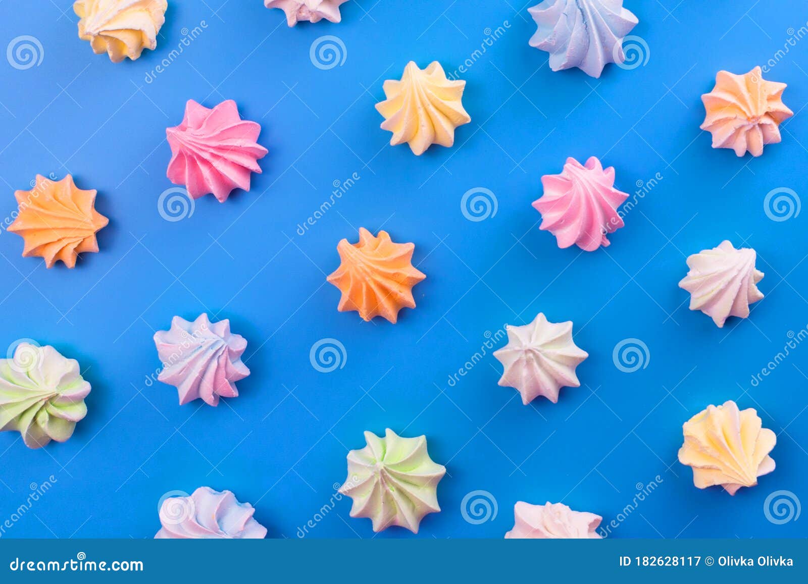 Multi-colored Meringues on a Light Blue Background. Flat Layout. View ...