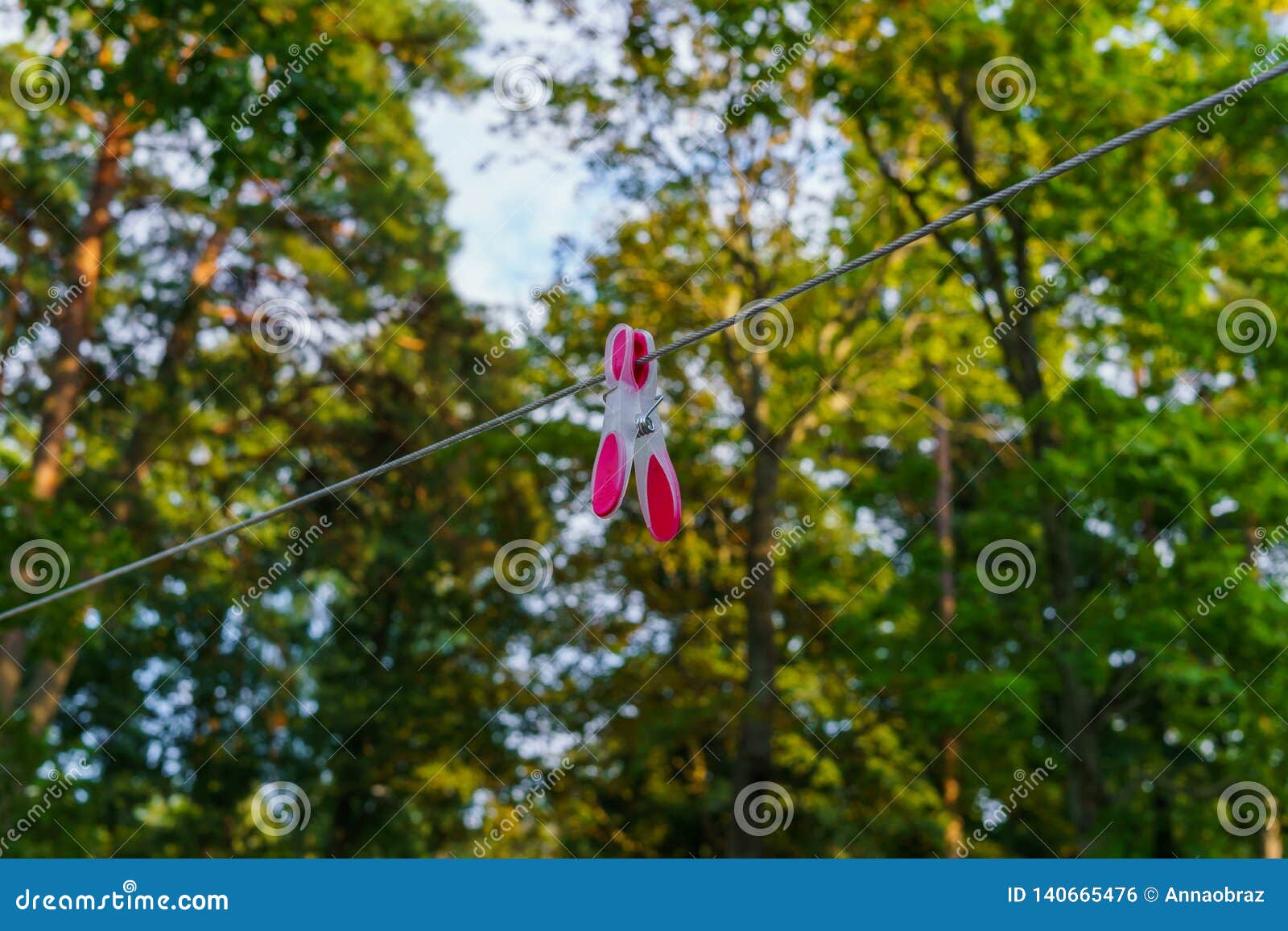 Multi-colored One Clothes Peg Attached To a Long Rope, in the Courtyard ...