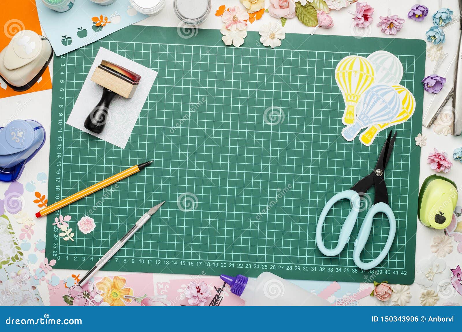 Multi-colored Paper, Scrapbooking Tools and Materials on Green Mat for ...
