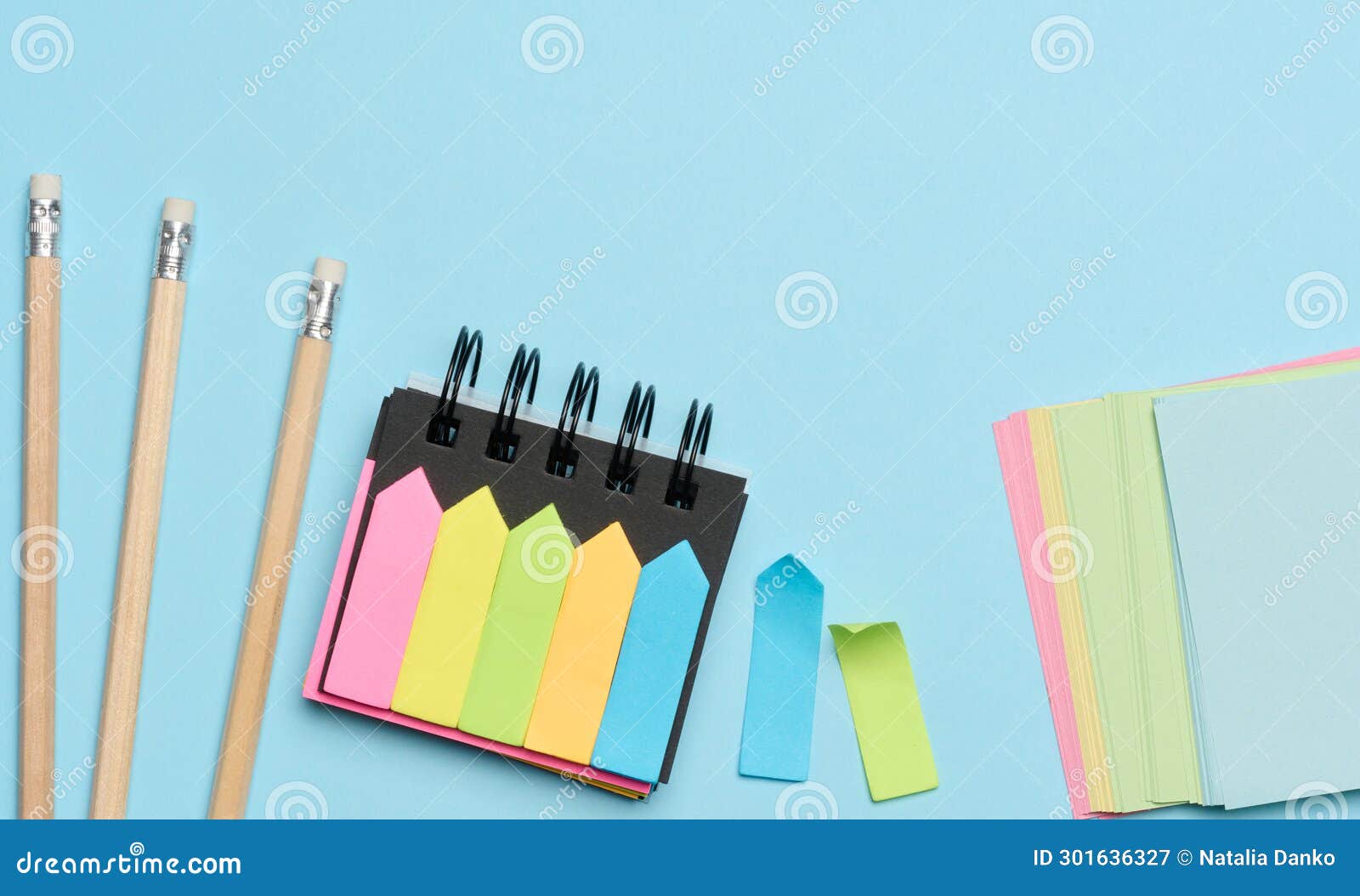 Multi-colored Paper Sticky Notes on a Blue Background Stock Image ...
