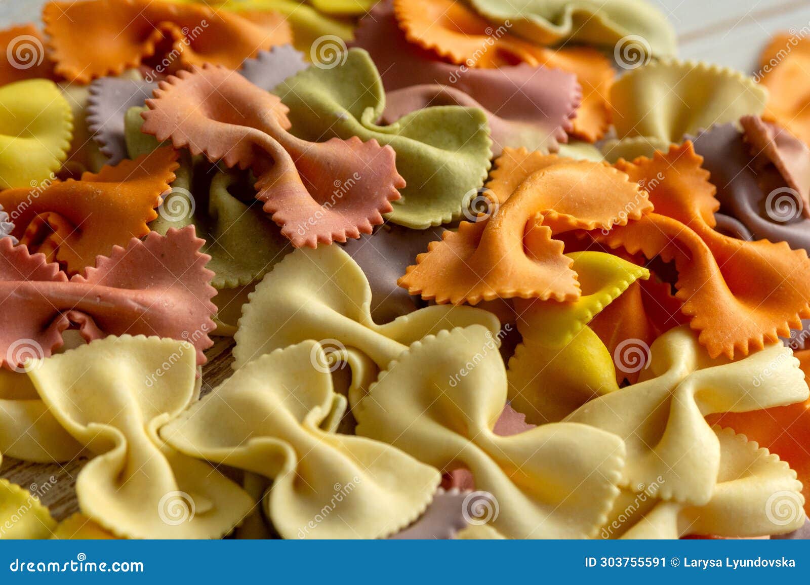 Multi-colored Pasta in the Shape of a Bow Tie is Laid Out on the ...