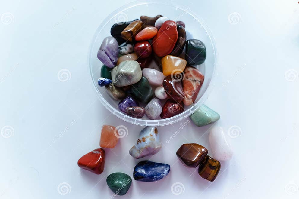 Multi-colored Pebbles of Different Sizes on a White Background Stock ...
