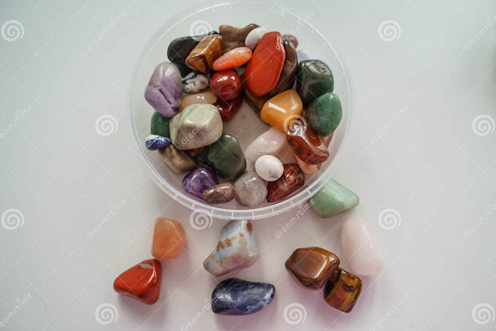 Multi-colored Pebbles of Different Sizes on a White Background Stock ...