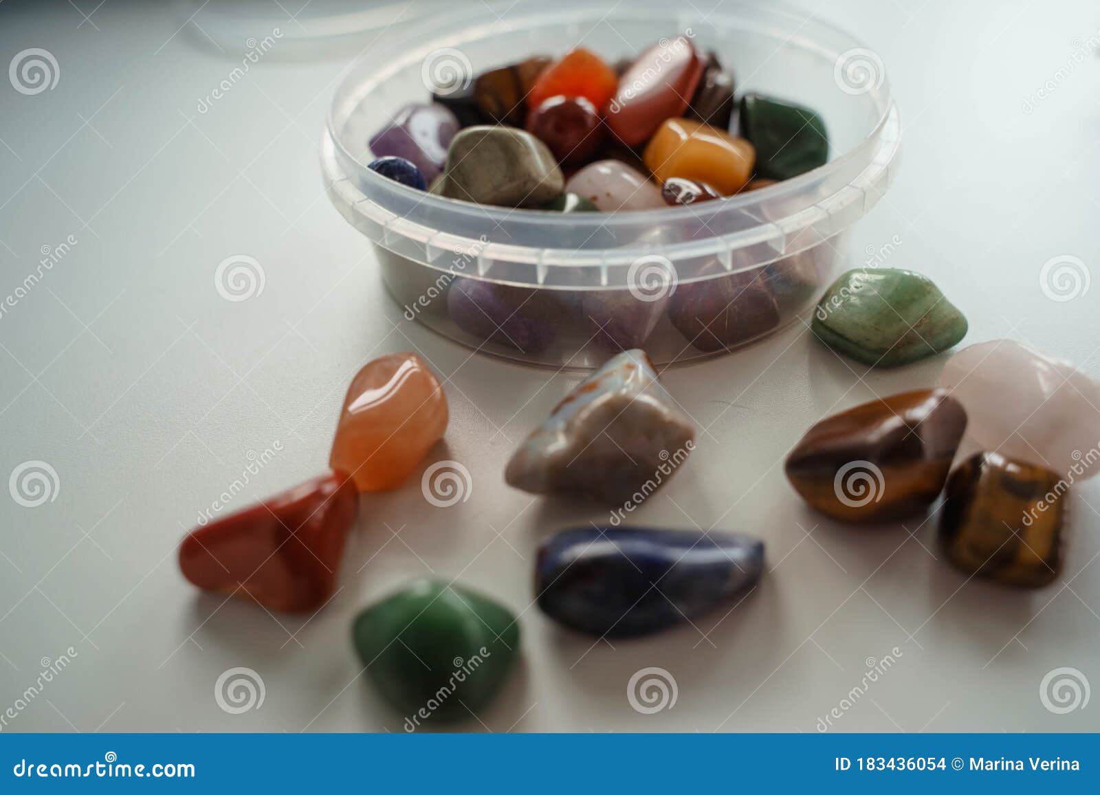 Multi-colored Pebbles of Different Sizes on a White Background Stock ...