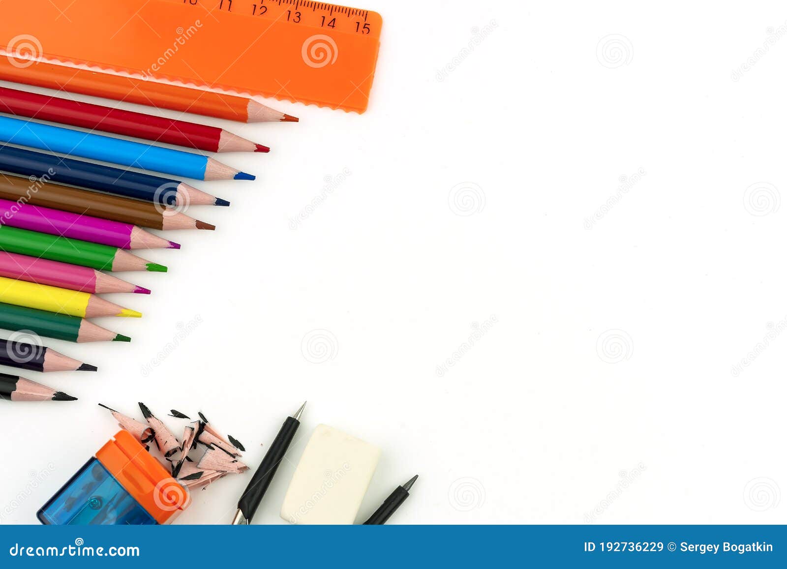 Multi-colored Pencils, Eraser, Ruler, Sharpener and Compasses on a ...