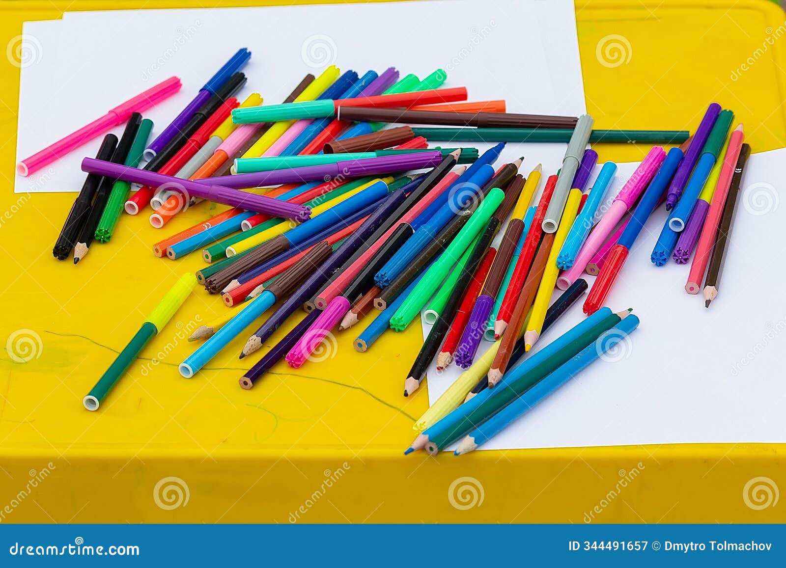 Multi-colored Pencils, Felt-tip Pens, Sheets of White Paper on the ...
