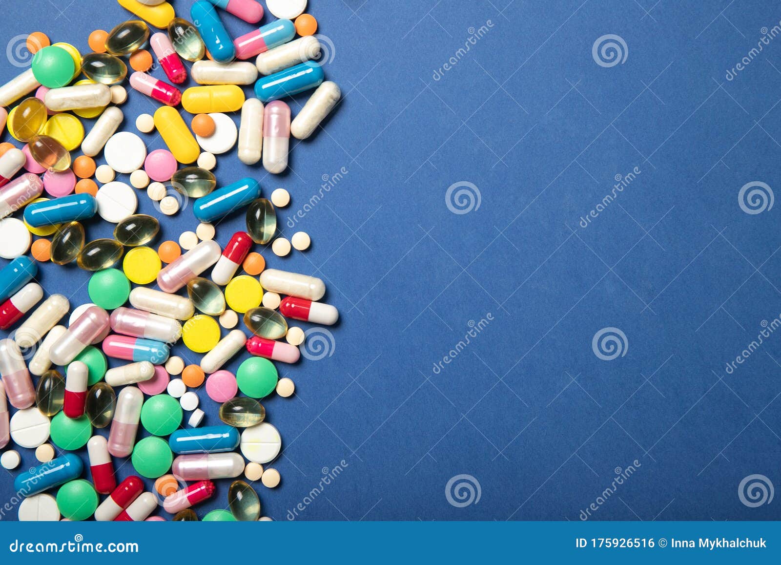 Multi-colored Pills on a Blue Background with Place for Text Stock ...