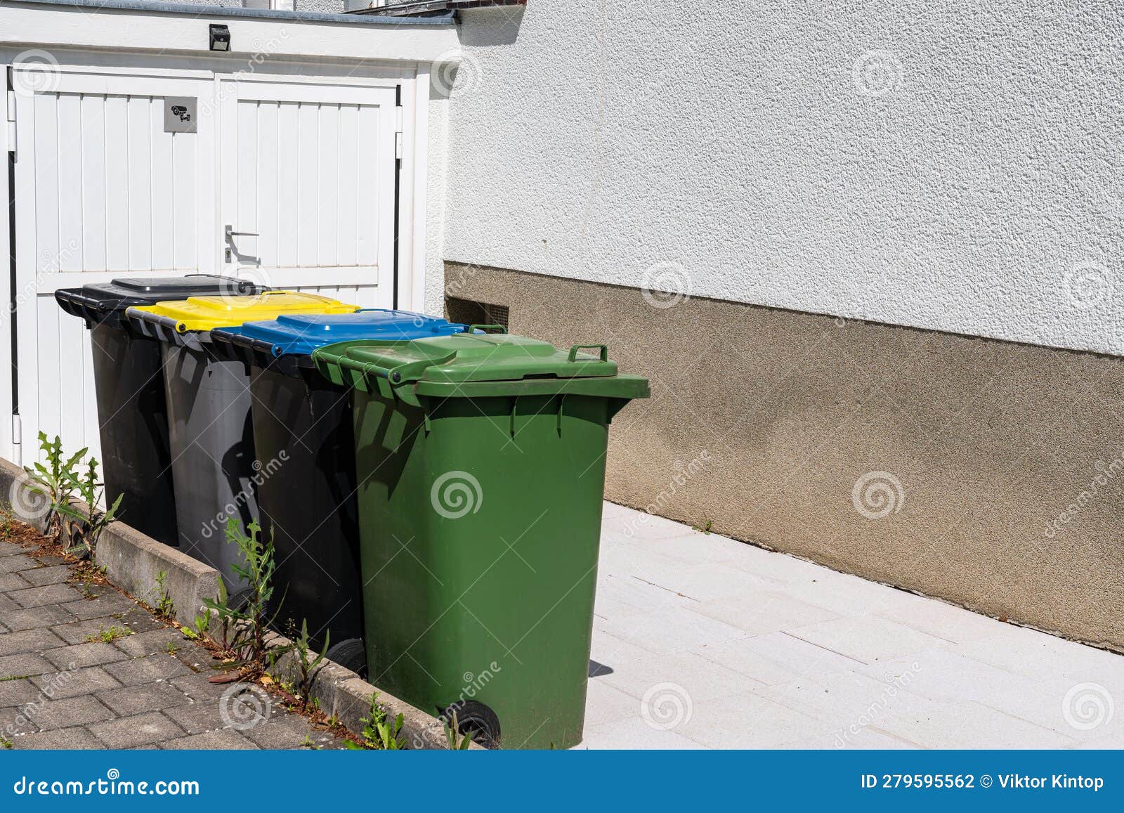 Multi-colored Plastic Bins for Separate Waste Collection Near the ...