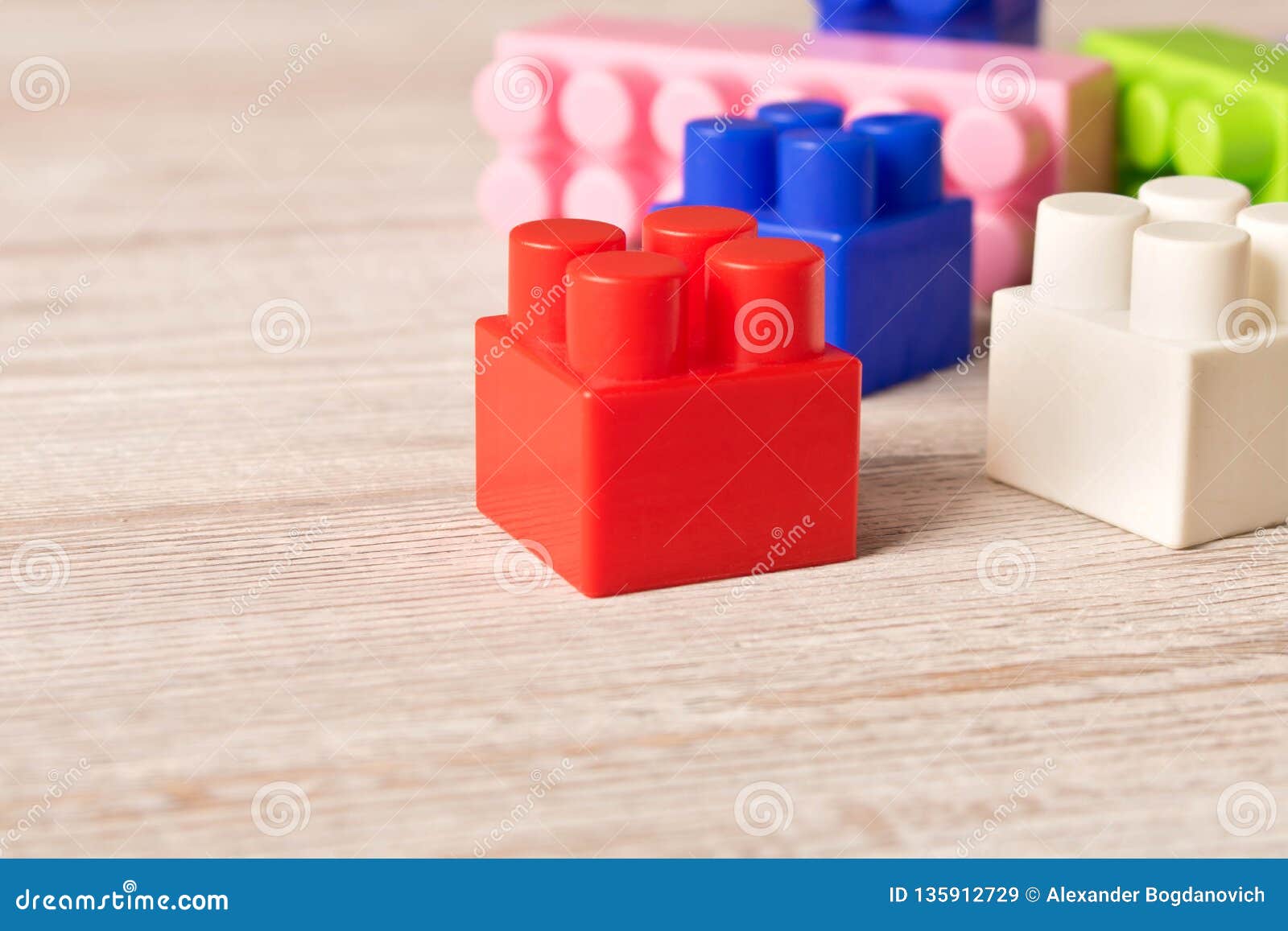 Multi-colored Plastic Construction Set on the Wooden Table . Children`s ...