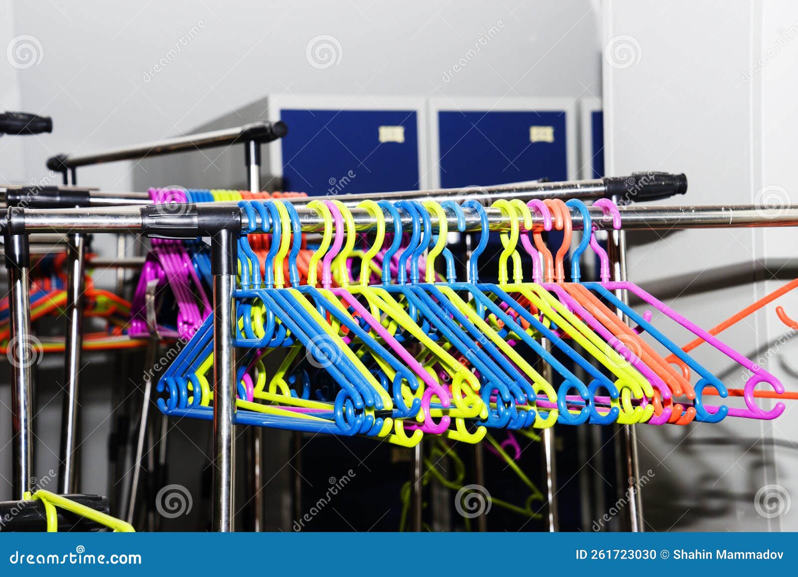 Multi-colored Plastic Hangers Hanging on an Iron Rack Stock Photo ...