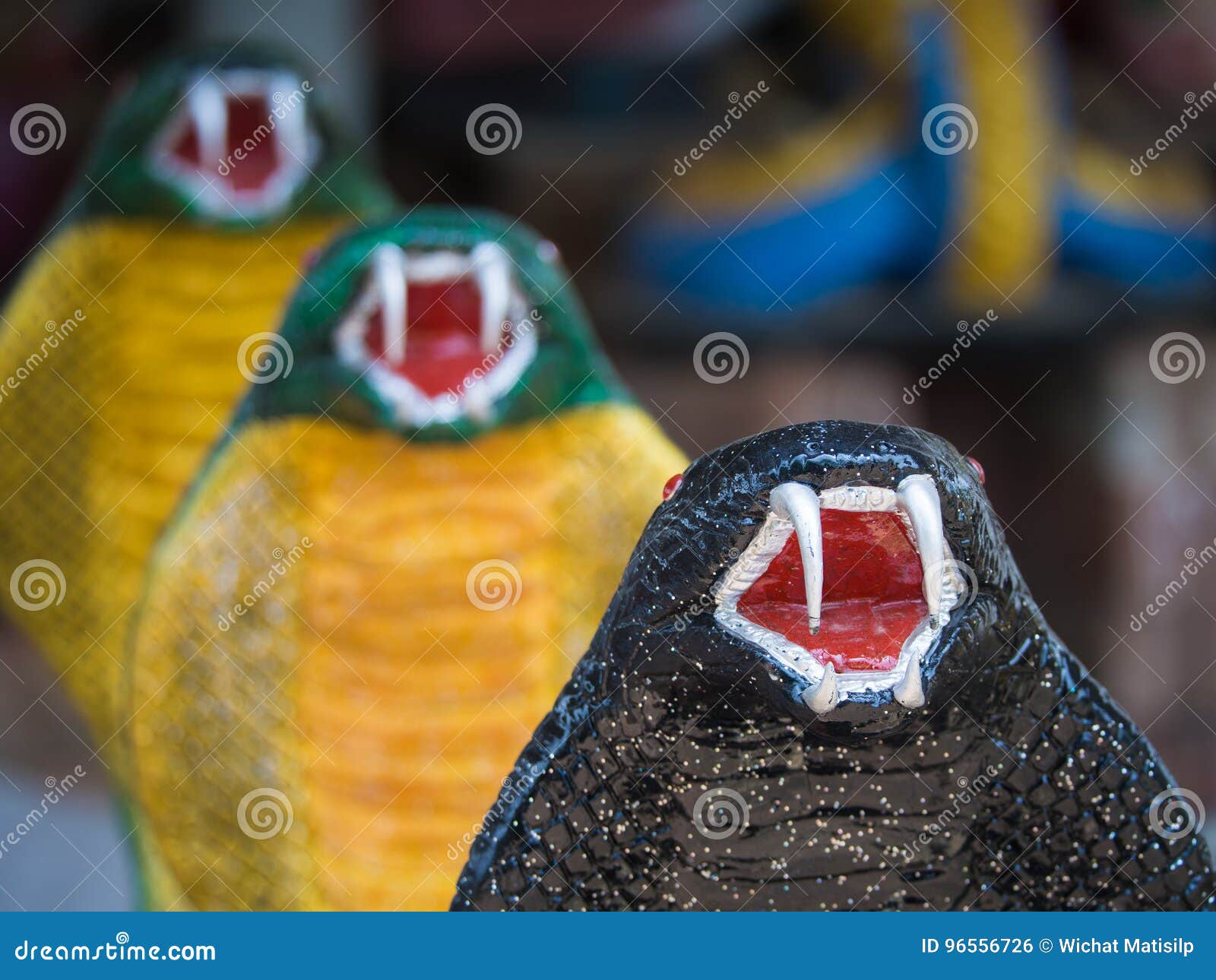 Multi-Colored Poisonous Snake Statues Arranged Stock Photo - Image of ...