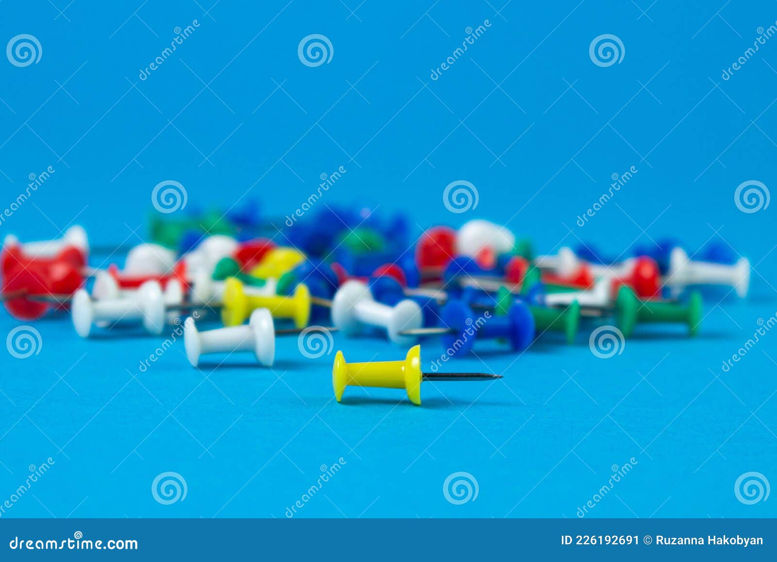 Multi-colored Push Pins on a Blue Background. Office Stationery Stock ...