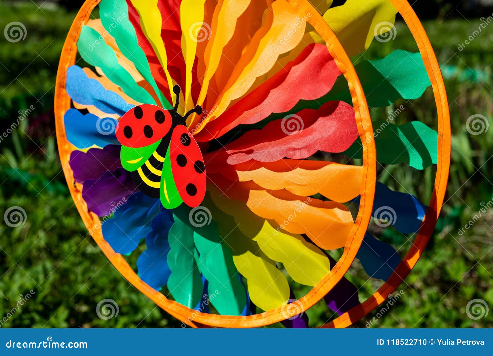 Multi Colored Round Pinwheel in Motion, in Sunny Garden. Big Round ...