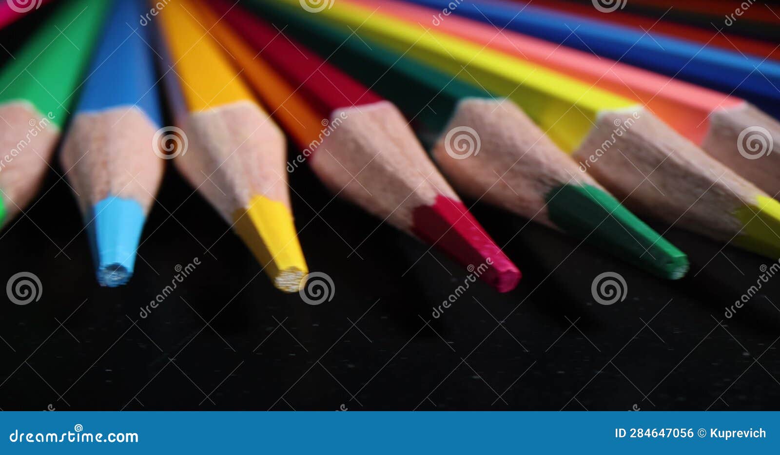 Multi-colored Sharpened Pencil Tips Lined Up on Black Surface Stock ...