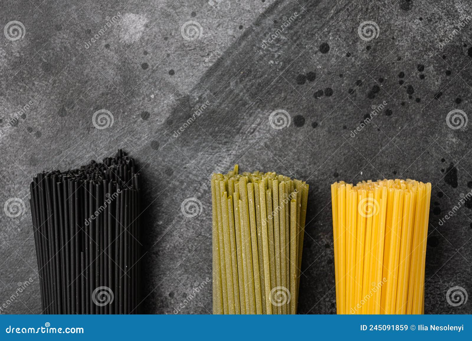 Multi Colored Spaghetti with Ingredients, on Black Dark Stone Table ...