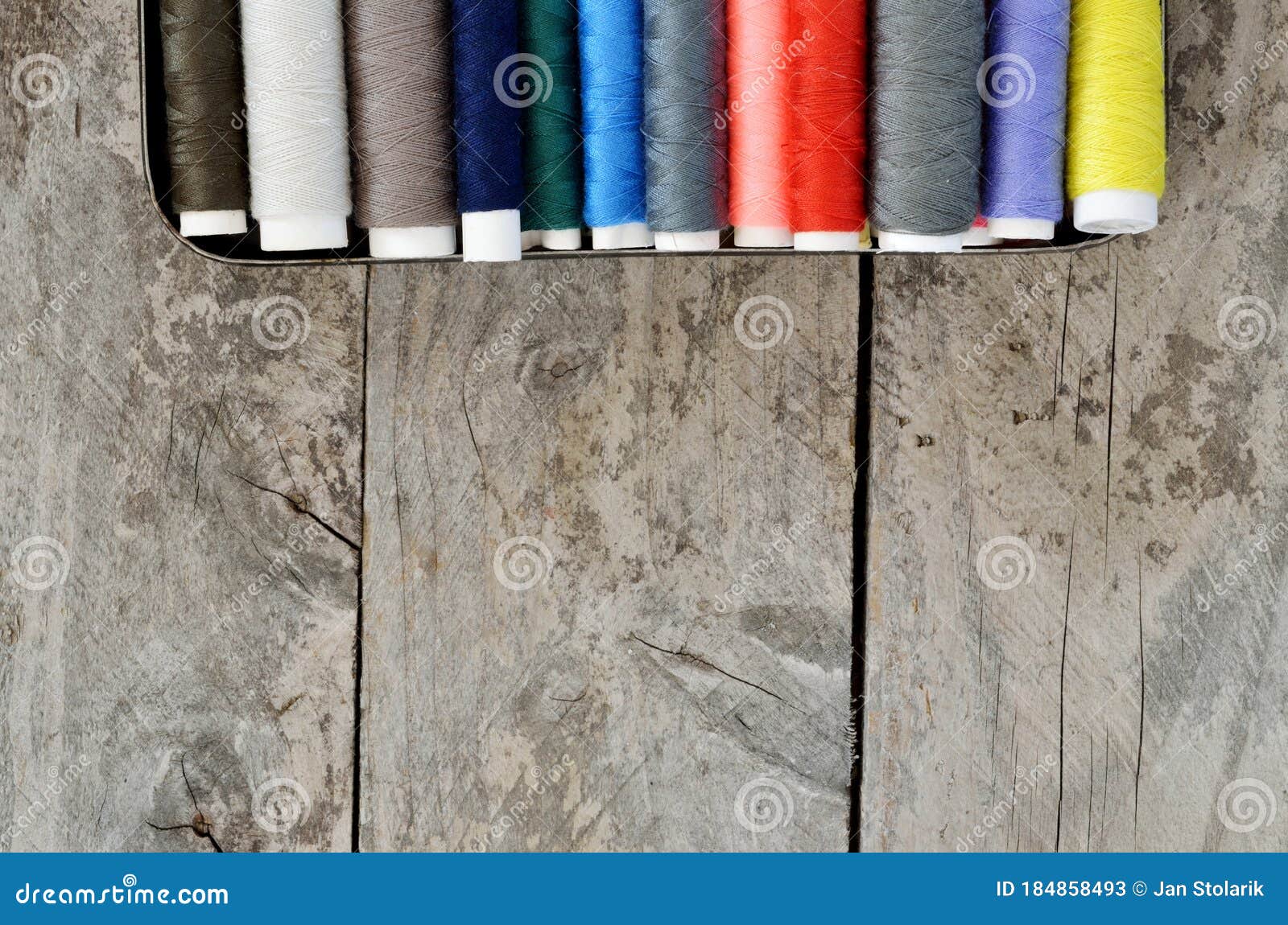 Multi-colored Spools of Thread on a Wooden Table Stock Image - Image of ...