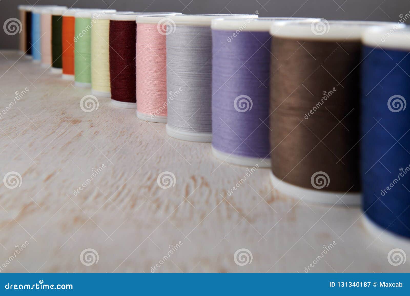 Multi-colored Spools of Threads Standing in a Row Stock Image - Image ...