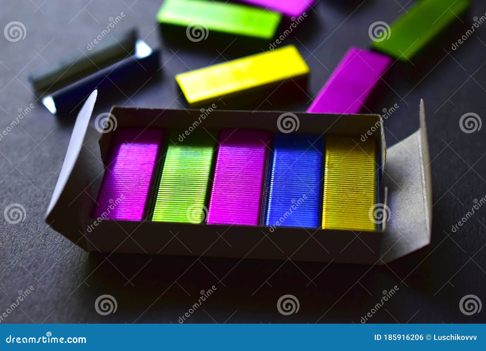 Multi-colored Stapler Staples on a Black Background Stock Photo - Image ...